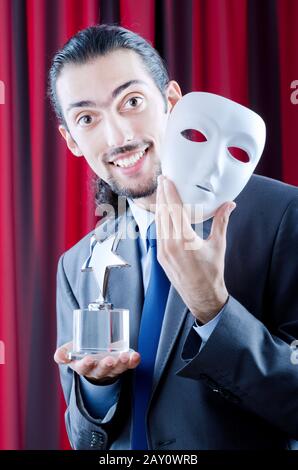 Man receiving award in mask Stock Photo - Alamy