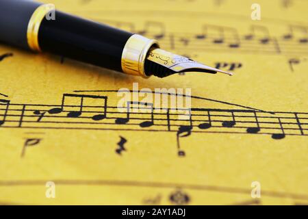 fountain pen on text sheet paper closeup Stock Photo - Alamy