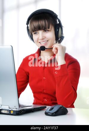 A friendly secretary/telephone operator in an office environment Stock ...