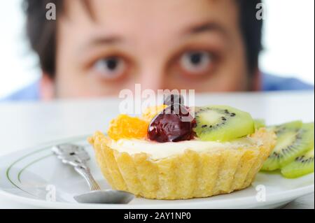 Looking with strawberry cake Stock Photo - Alamy