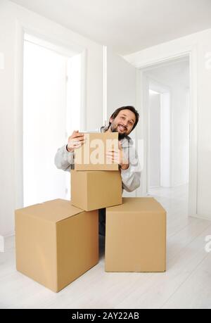 Man moving house with boxes Stock Photo - Alamy