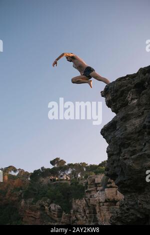 Man jumping into the void Stock Photo - Alamy