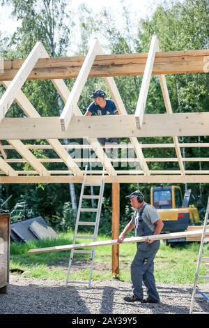 Carpenters working at a construction site Stock Photo - Alamy