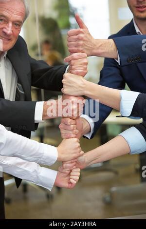 Business people, fist and stack in office for teamwork, inclusion or ...