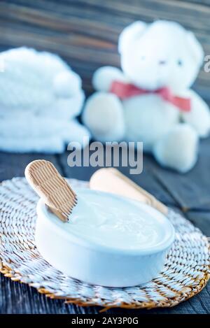 Baby food and milk on napkin close up Stock Photo - Alamy