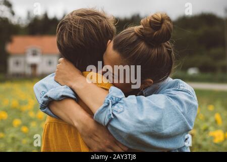Female couple hugging Stock Photo - Alamy