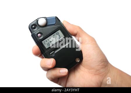Modern flash meter use by hand Stock Photo - Alamy