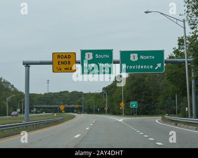 Directional signs at an intersection with arrows to Providence and New ...