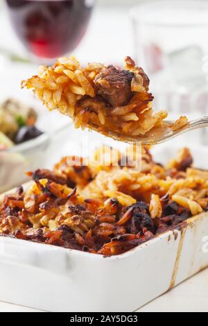 Giouvetsi - traditional Greek baked dish with beef and orzo pasta in ...