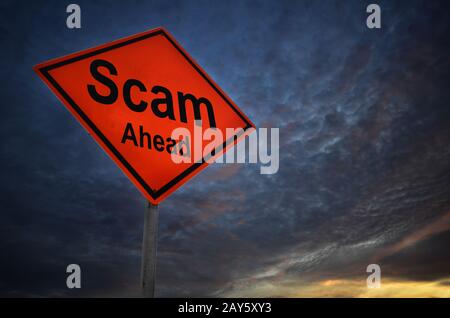 Scam ahead warning road sign Stock Photo - Alamy