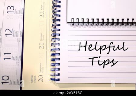 Helpful tips write on notebook Stock Photo - Alamy