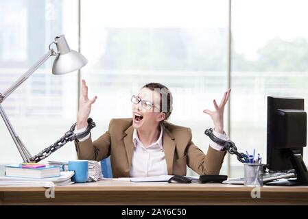 woman handcuffed to her desk at work Stock Photo - Alamy
