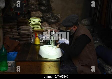February 8, 2020: Peshawar, Pakistan. A traditional workshop producing ...