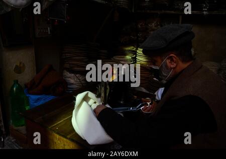 February 8, 2020: Peshawar, Pakistan. A traditional workshop producing ...