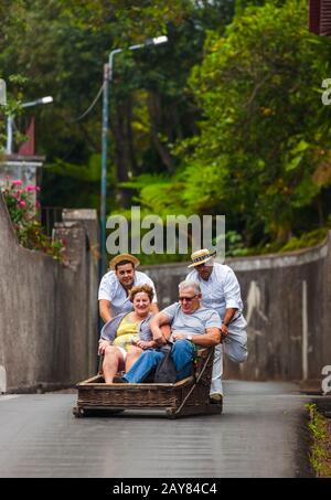 FUNCHAL, MADEIRA - SEPTEMBER 19: Traditional downhill sledge trip on ...