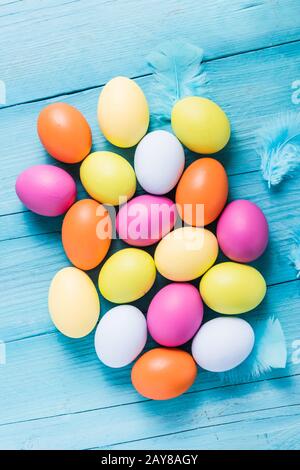 Easter eggs in pastel colors on a green background with grass texture ...