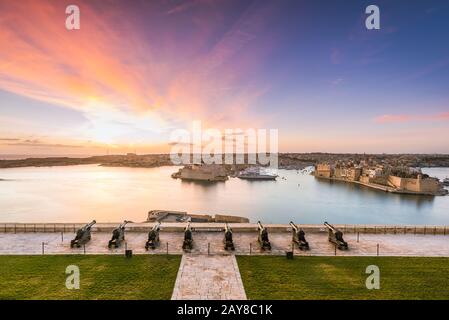 Beautiful sunrise over Three Cities in Malta Stock Photo - Alamy