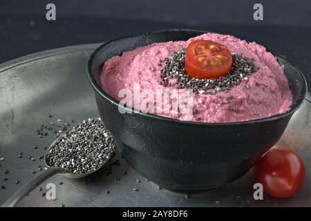 Hummus with chia seeds Stock Photo - Alamy