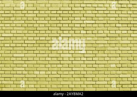 Limelight colored brick wall background Stock Photo - Alamy