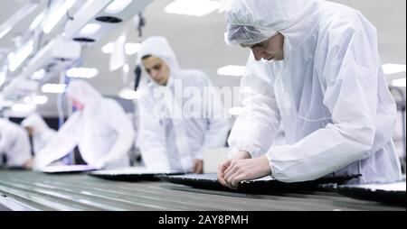 Minsk, Belarus - May 08, 2018: workshop for assembring televisions ...