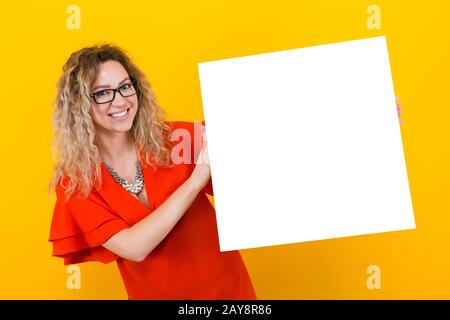 Blonde woman in dress with blank paper Stock Photo - Alamy
