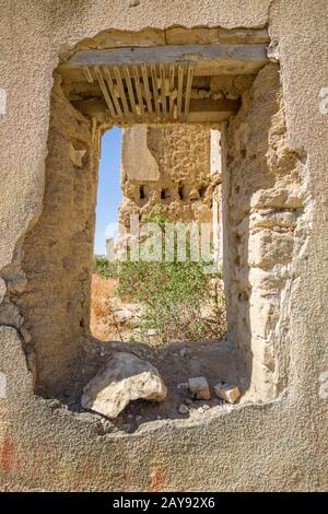 Ruins at the deserted village of Ayios Sozomenos, Cyprus. A visit to the village is a trip to ...