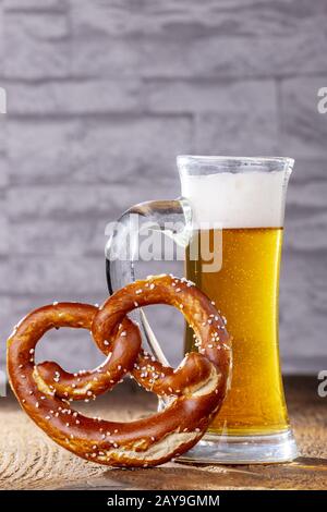 Measure jug with pretzel Stock Photo - Alamy