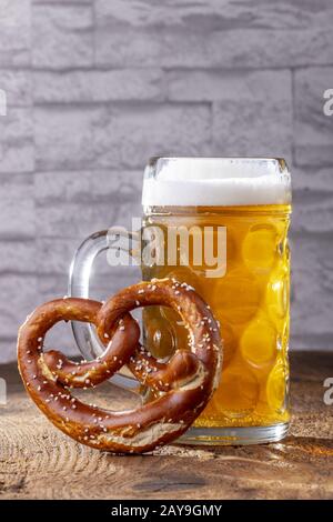 Measure jug with pretzel Stock Photo - Alamy