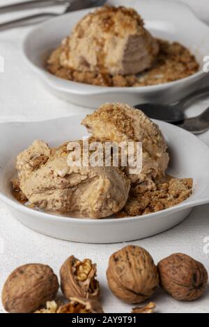 Two portions of walnut ice cream Stock Photo - Alamy