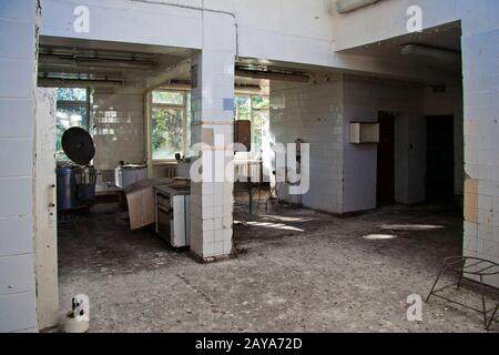Abandoned and ruined kitchen of closed factory canteen or restaurant ...