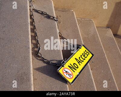 No entry sign and yellow chain in front of stair steps Stock Photo - Alamy