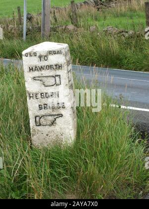 Ancient route marker signpost carved stone with hand symbol Stock Photo ...