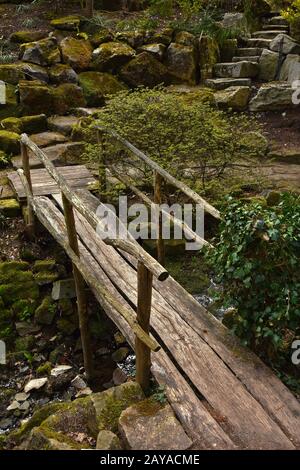 stone path with wooden bridge Stock Photo - Alamy