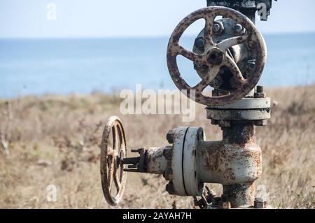 An Old weathered valve on water boiler Stock Photo - Alamy