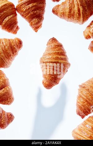 Pastry frame with shadow from hand on a light background Stock Photo ...