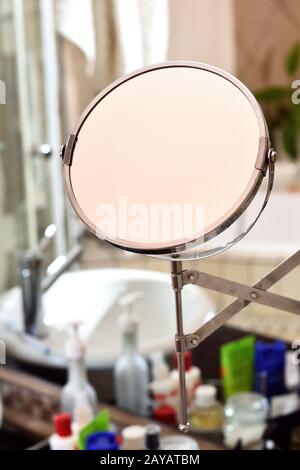 White bathtub placed in light bathroom with ceramic sinks and mirror ...