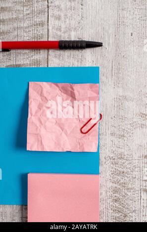 Above blank paper stick note list yellow, green and blue with the face ...