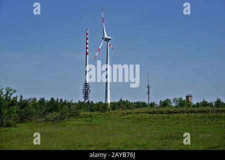 Transmission mast and wind turbine on the Hornisgrinde mountain in the ...