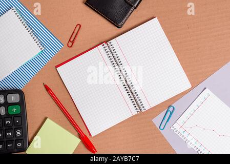 Cardboard desk with a striped blue sheet, notebook paper and office ...