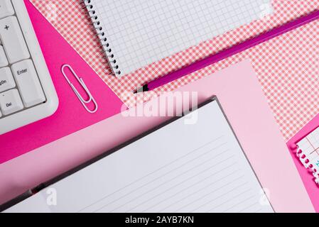 Writing equipments and computer stuffs plus mathematic paper placed on ...