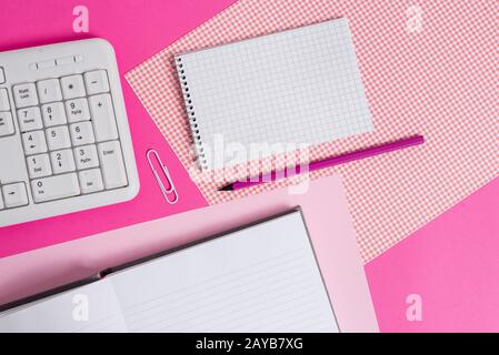 Writing equipments and computer stuffs plus mathematic paper placed on ...