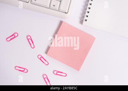 PC keyboard, mouse, paper notepad, glasses and cup of coffe on a desk ...