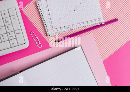 Writing equipments and computer stuffs plus mathematic paper placed on ...