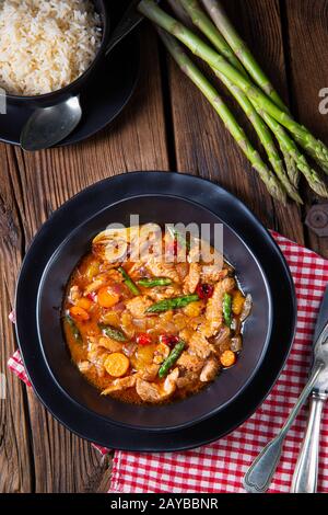 Turkey fricassee on rice with asparagus and paprika Stock Photo - Alamy