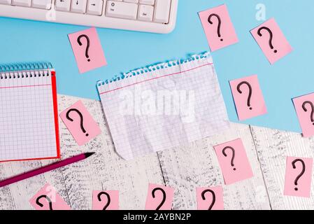 Writing tools, computer stuff and math book sheet on top of wooden ...