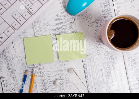 Writing equipment and computer stuff plus scribbled paper placed on a ...