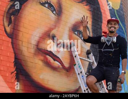 Artist Armando Silva while working on a mural at the Boulder Chamber of ...
