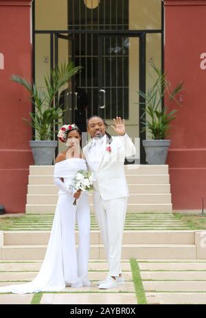 PORT OF SPAIN, TRINIDAD - FEB 14: Renee Butcher is escorted by her ...