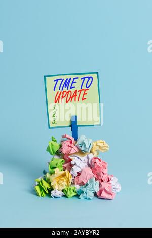 Conceptual hand writing showing Update. Concept meaning by adding new ...