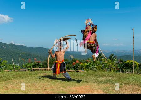 Manggarai men performing a traditional Caci dance in a Melo Village in ...